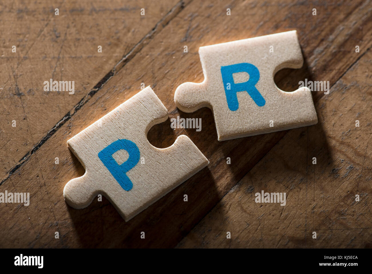 Word PR on wooden puzzle Stock Photo - Alamy