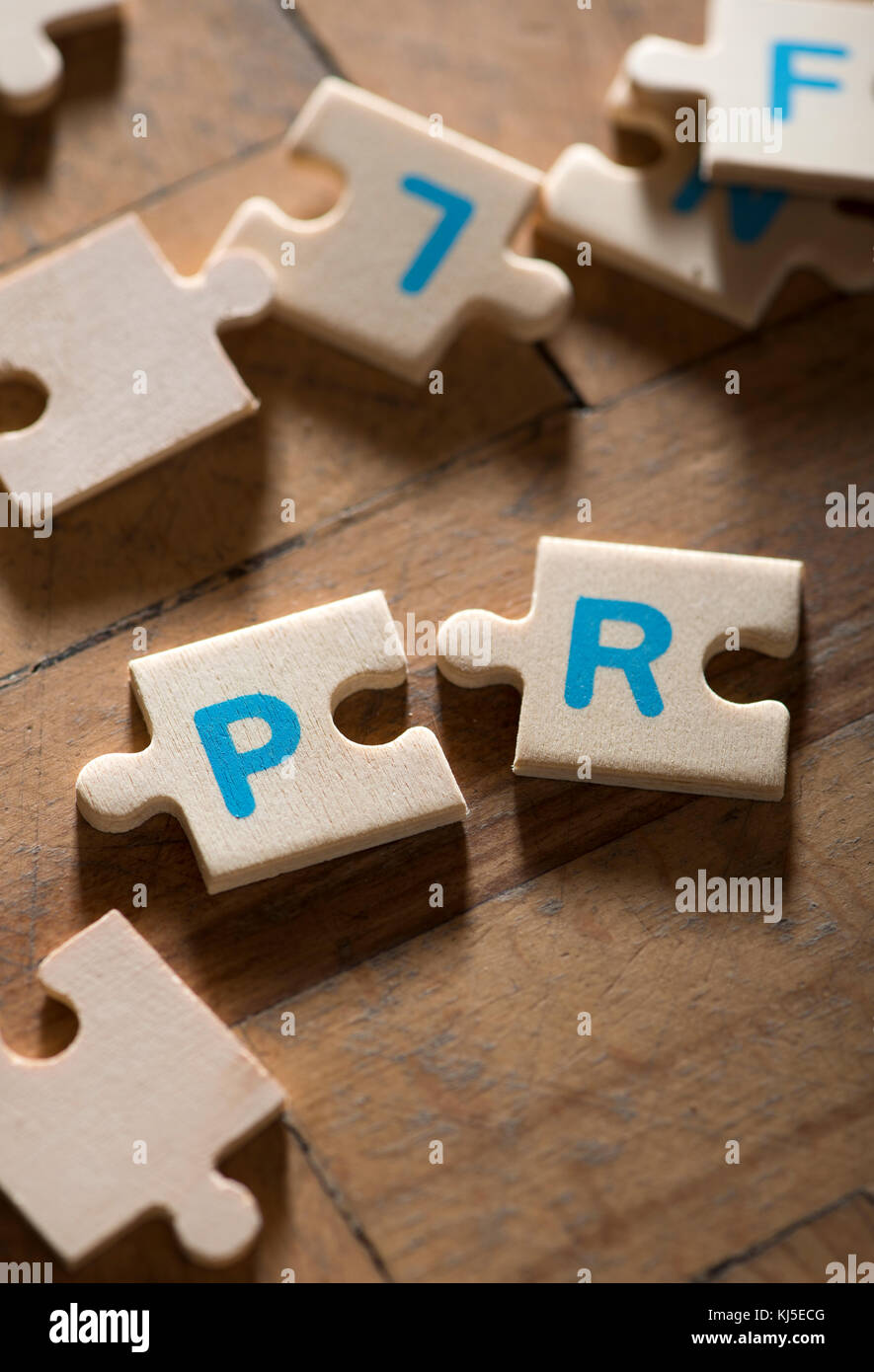 Word PR on wooden puzzle Stock Photo - Alamy
