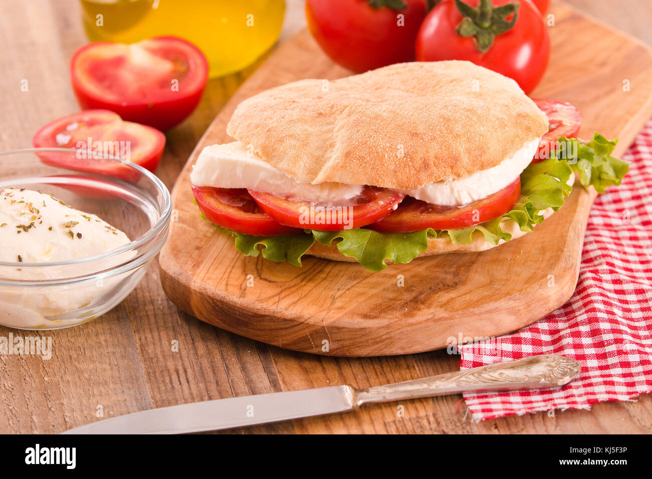 Puccia bread with mozzarella and tomato Stock Photo - Alamy