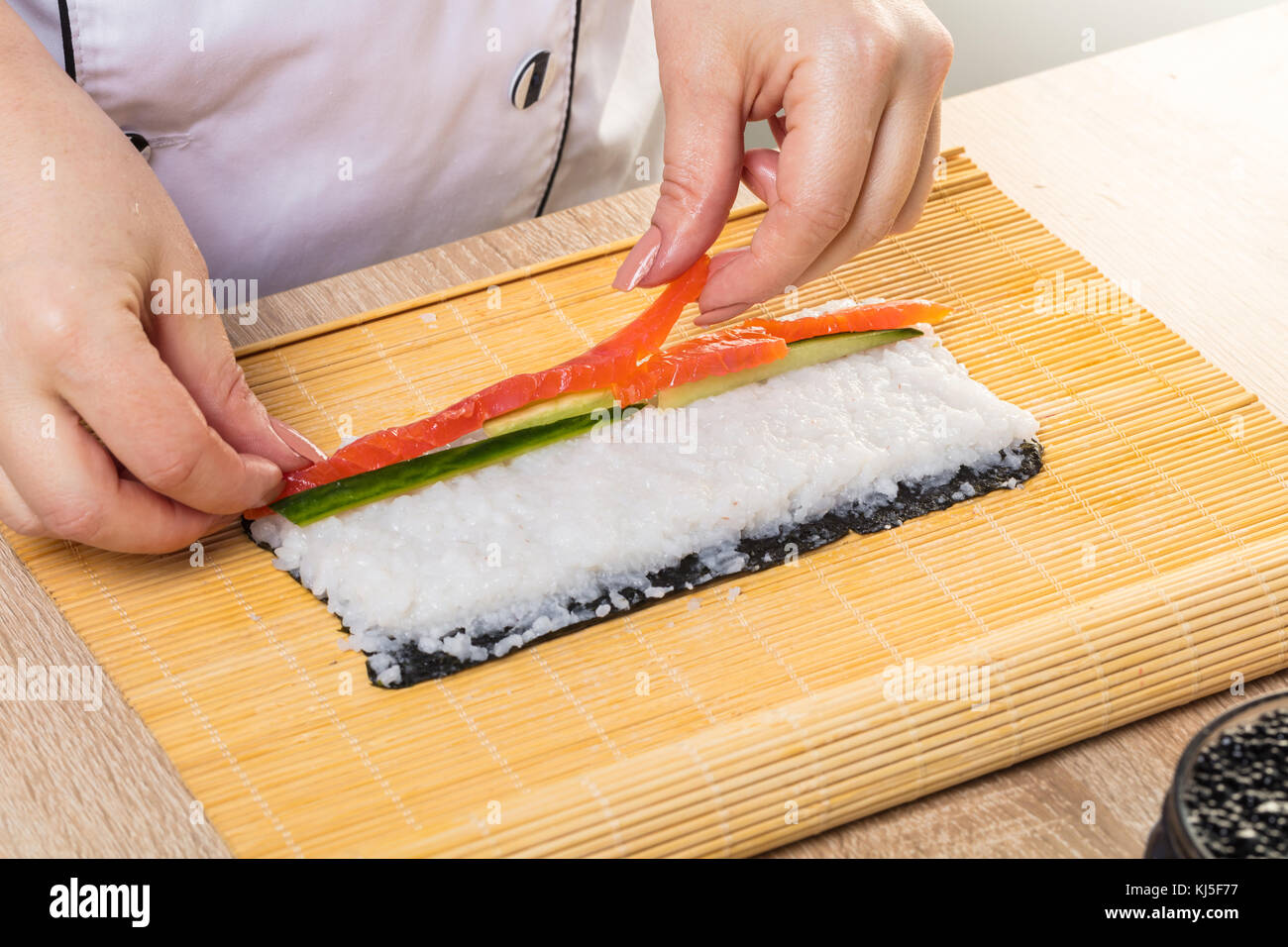 Japanese chef. Chef prepares rolls, hands closeup Stock Photo - Alamy