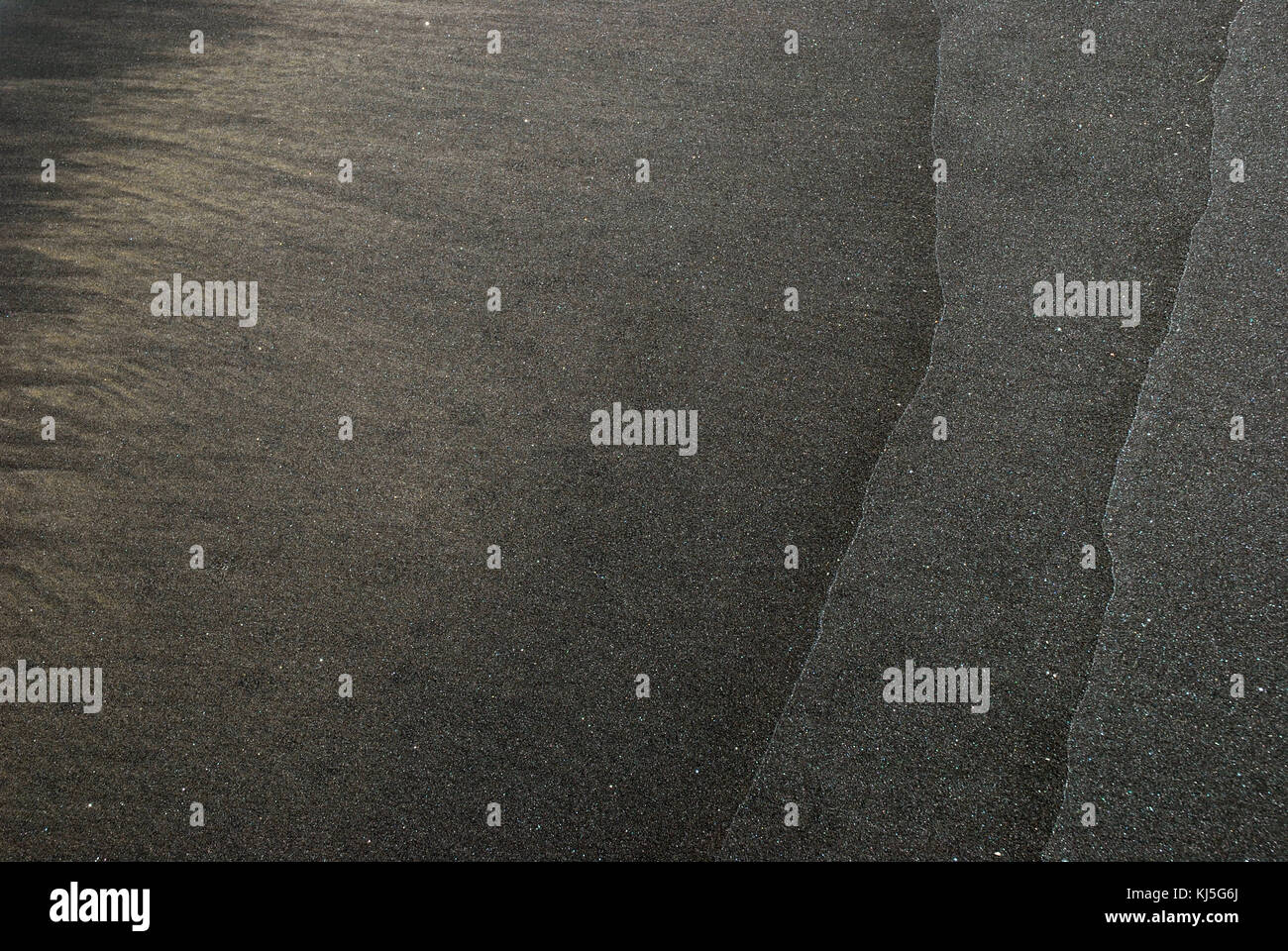 Black sand of Piha Beach near Auckland in the North Island, New Zealand ...