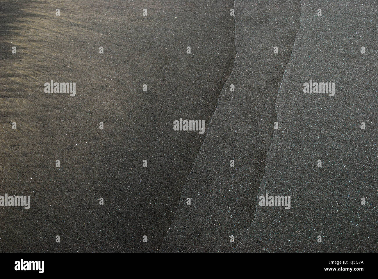Black sand of Piha Beach near Auckland in the North Island, New Zealand ...