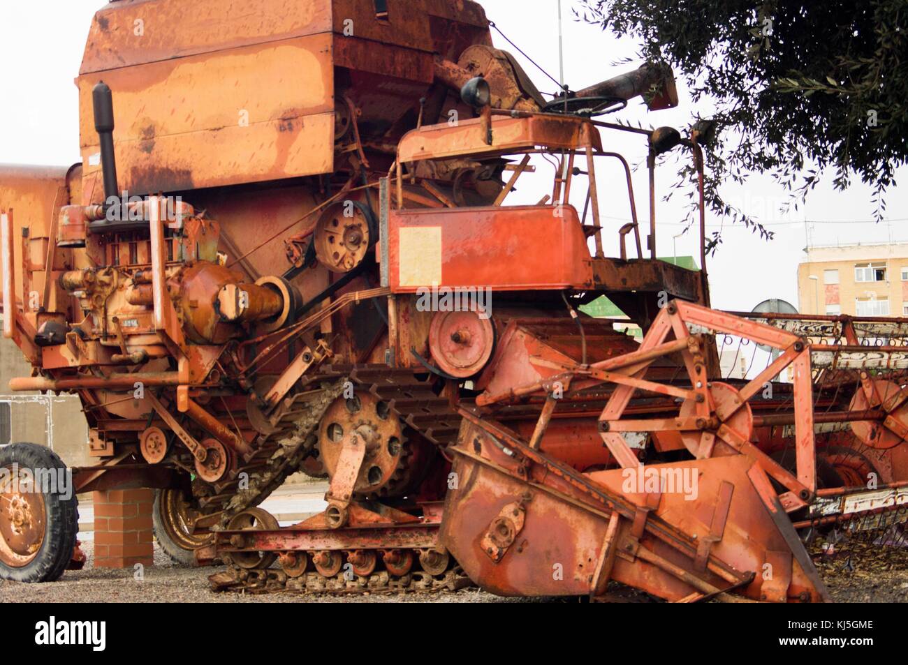Old machine recolectora of olives exposed in a rotunda of city Stock ...