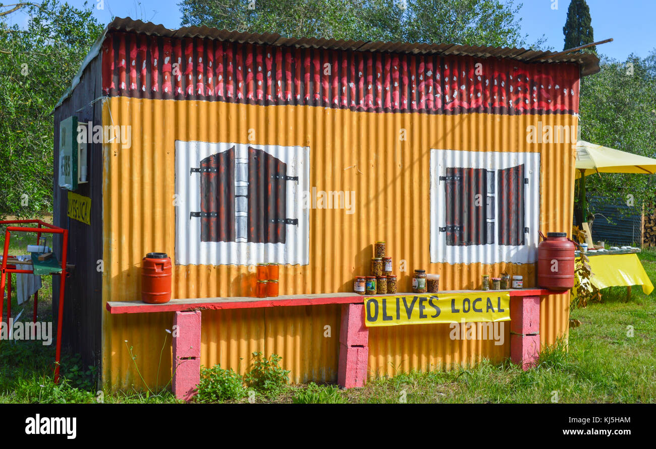 A rustic roadside hut selling local produce of olives, honey and oil ...