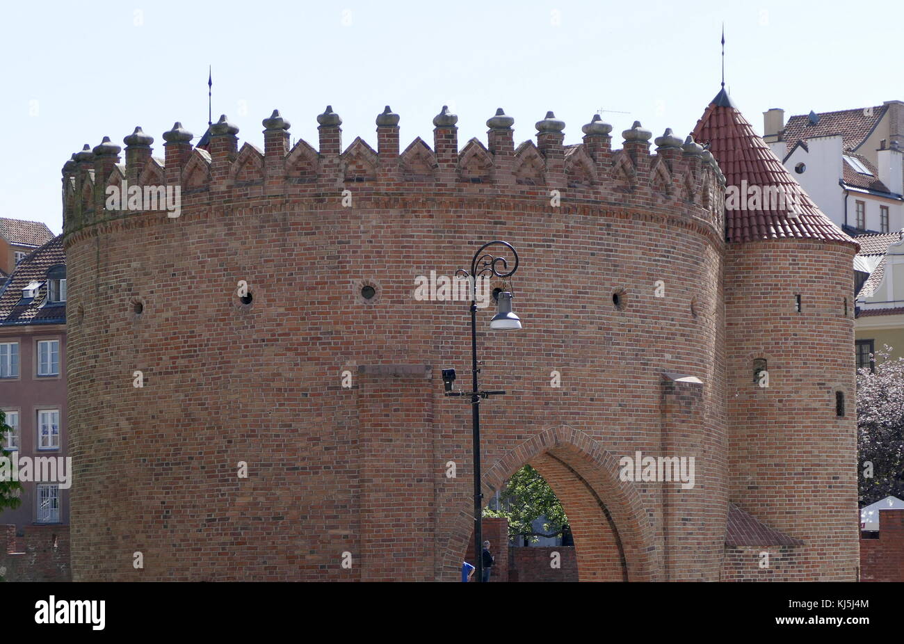 gate tower, inside a section of the medieval wall in Warsaw Old Town is ...