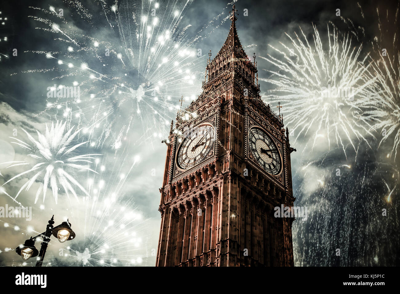 explosive fireworks display fills the sky around Big Ben. New Year's ...