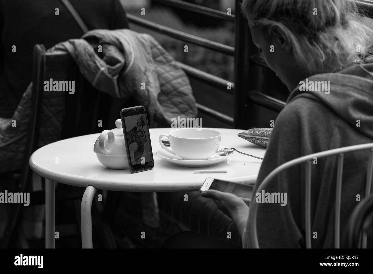 Face Timing Over a Cup Of Tea Stock Photo - Alamy