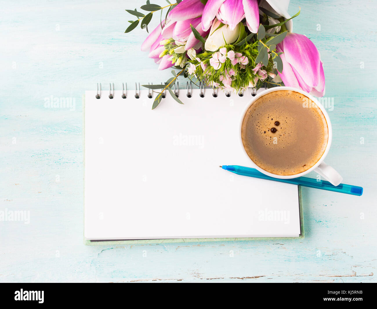 Blank empty notebook page with blue pen and cup of coffee. Spring ...