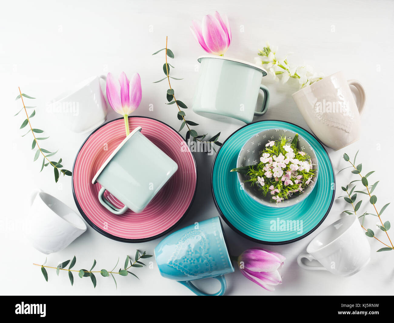 Spring tableware crockery concept with tulips flowers pastel color ...