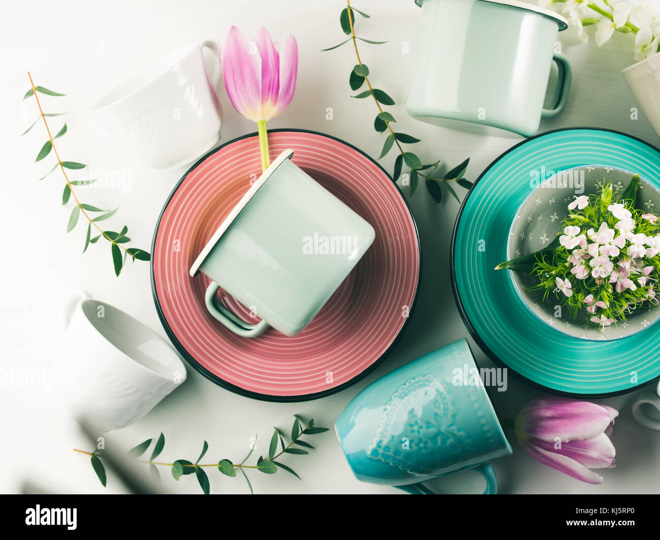 Spring tableware crockery concept with tulips flowers pastel color ...
