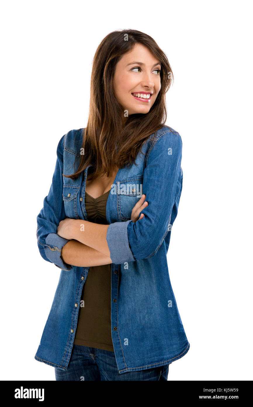 Beautiful woman standing over a white background and lokking to the ...