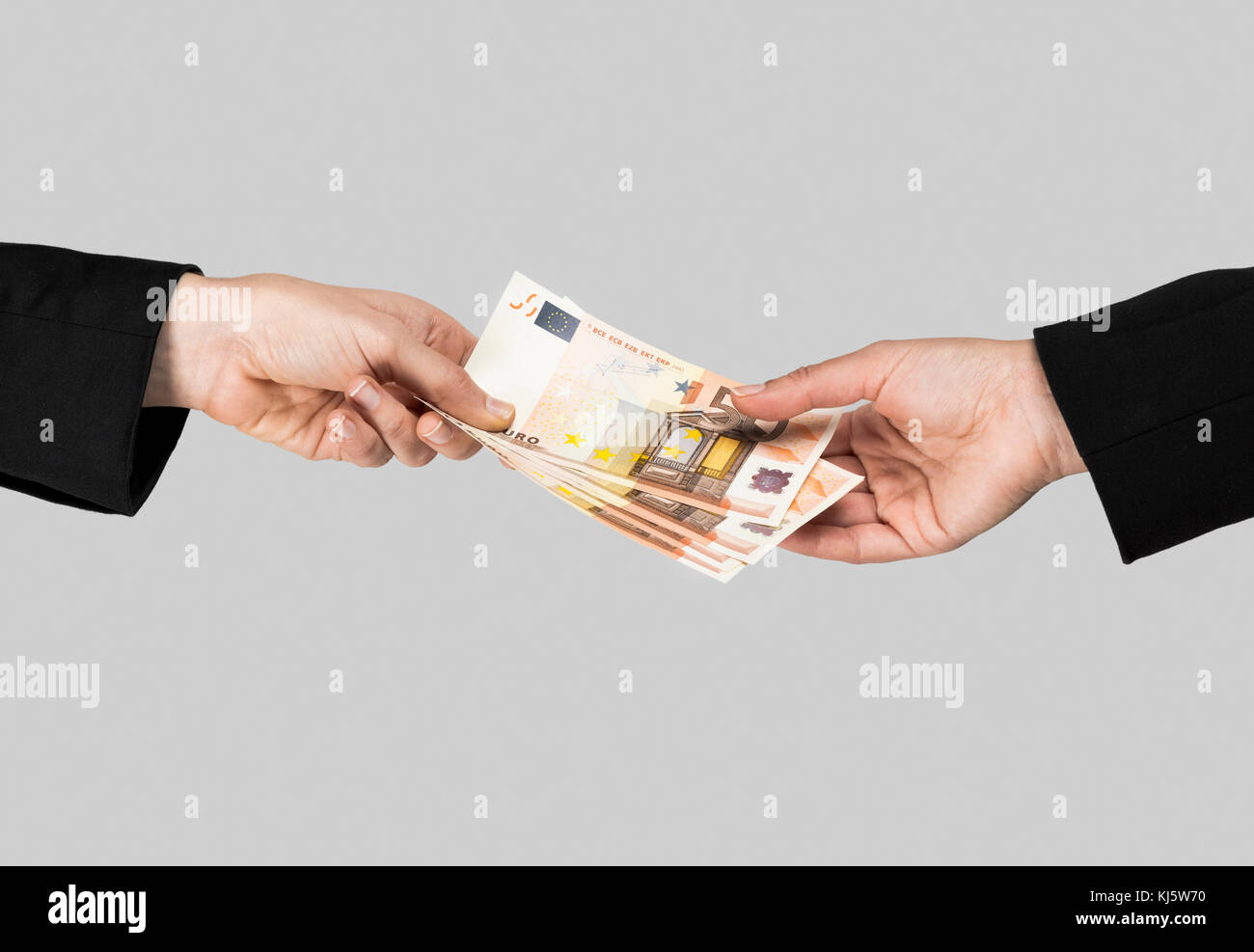 Concept image of hands making and receiving a payment, isolated over a ...