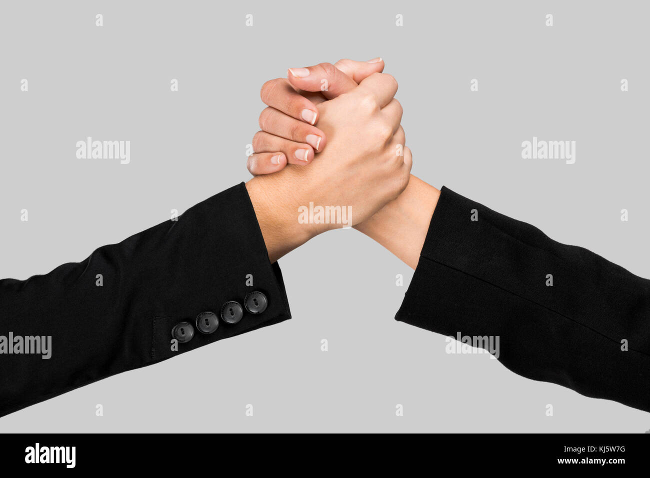 Greeting hands over a gray background Stock Photo - Alamy
