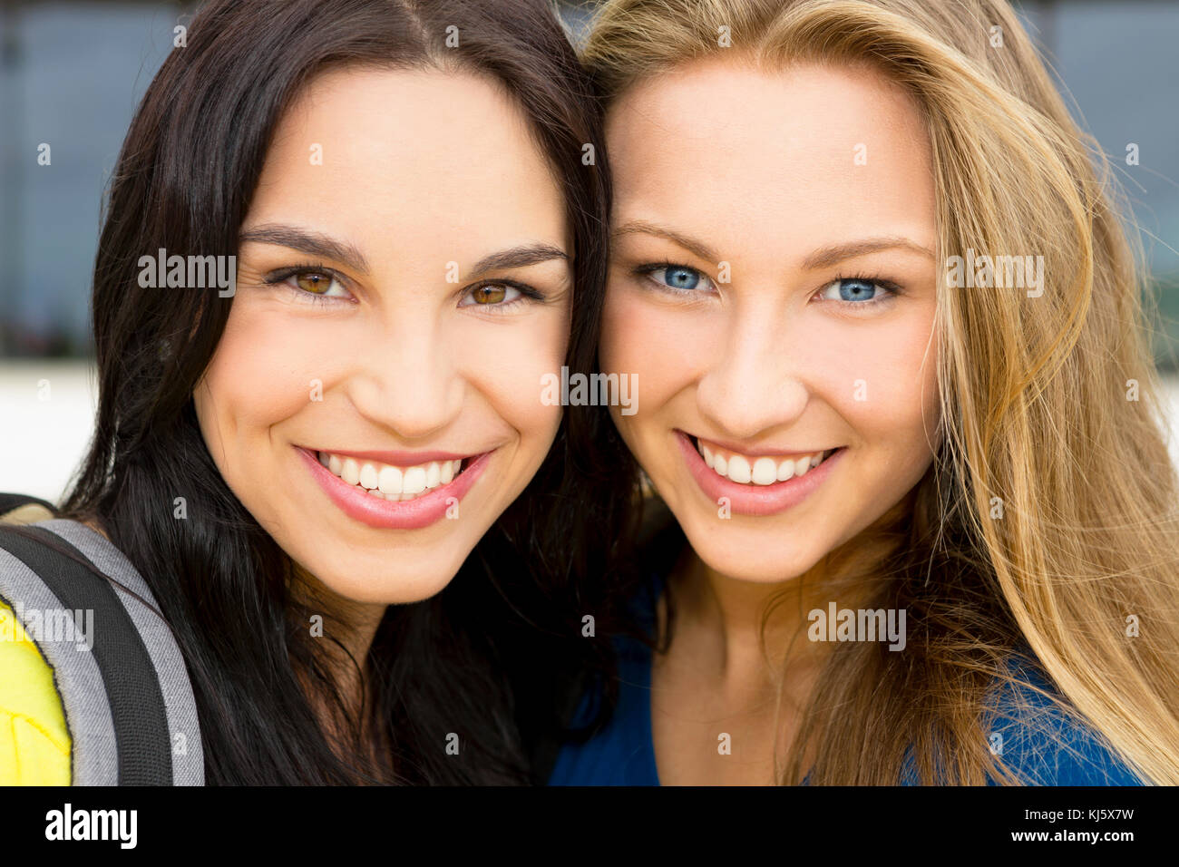 Portrait of a beautiful two young girls smiling Stock Photo - Alamy Portrait of a beautiful two young girls smiling Stock Photo - Alamy