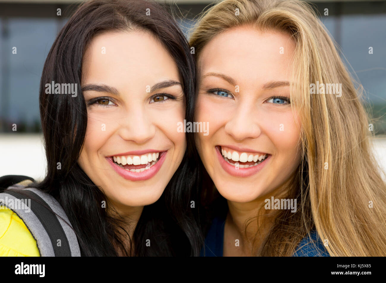 Portrait of a beautiful two young girls smiling Stock Photo - Alamy Portrait of a beautiful two young girls smiling Stock Photo - Alamy