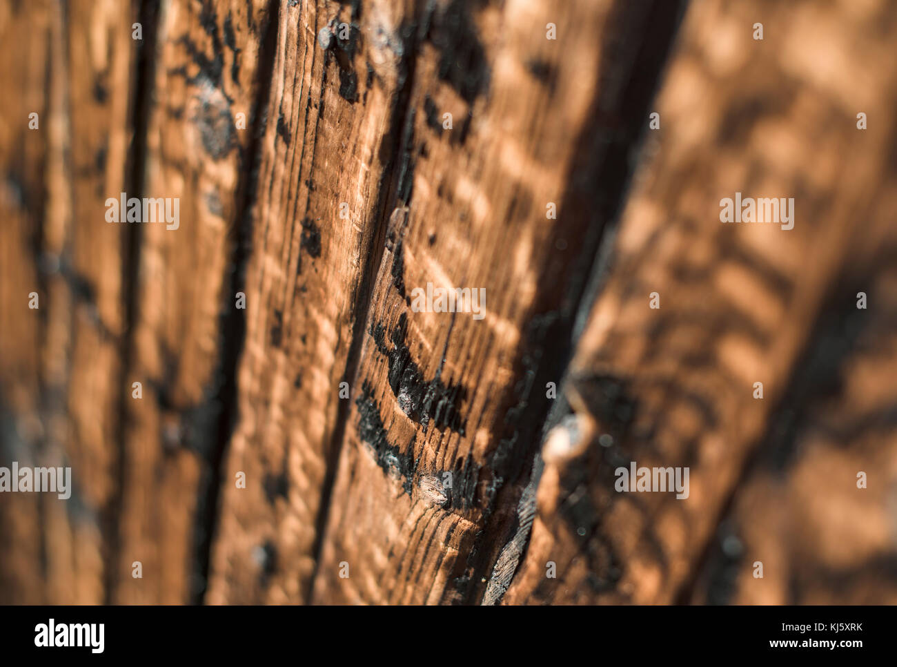 Burnt wooden boards background Stock Photo - Alamy