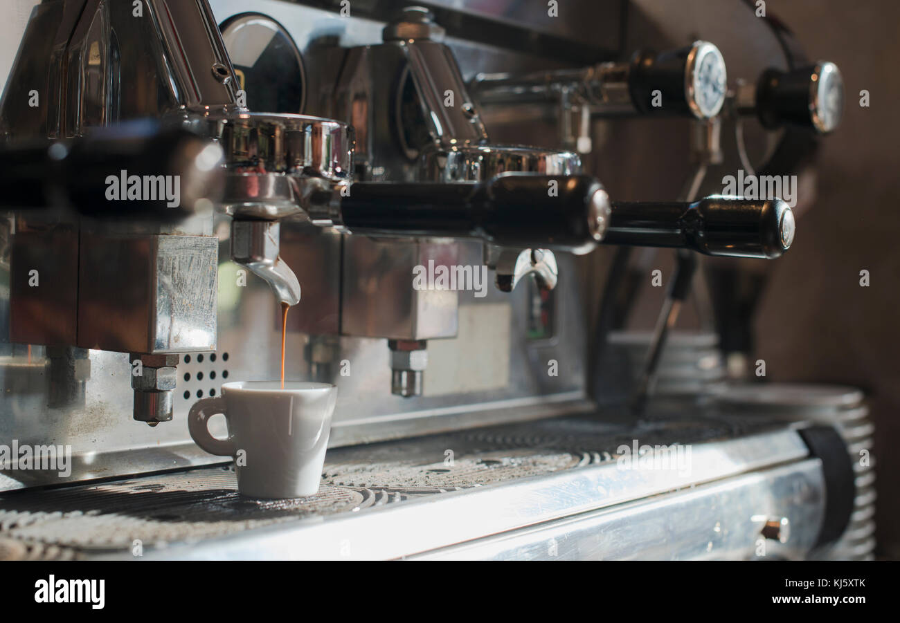 Making coffee on professional coffee machine. Natural light Stock Photo ...