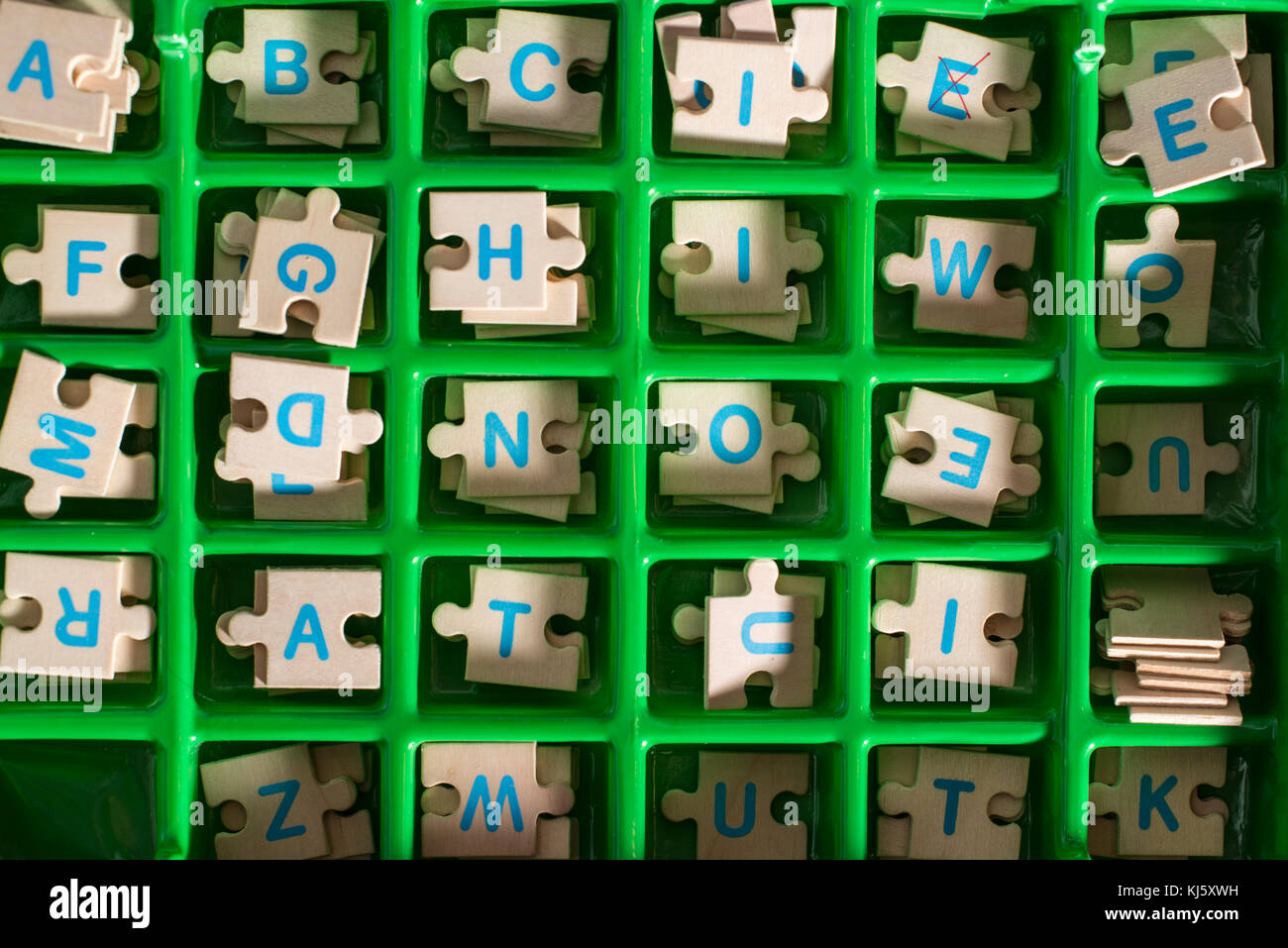 Letters on vintage wooden puzzle Stock Photo - Alamy