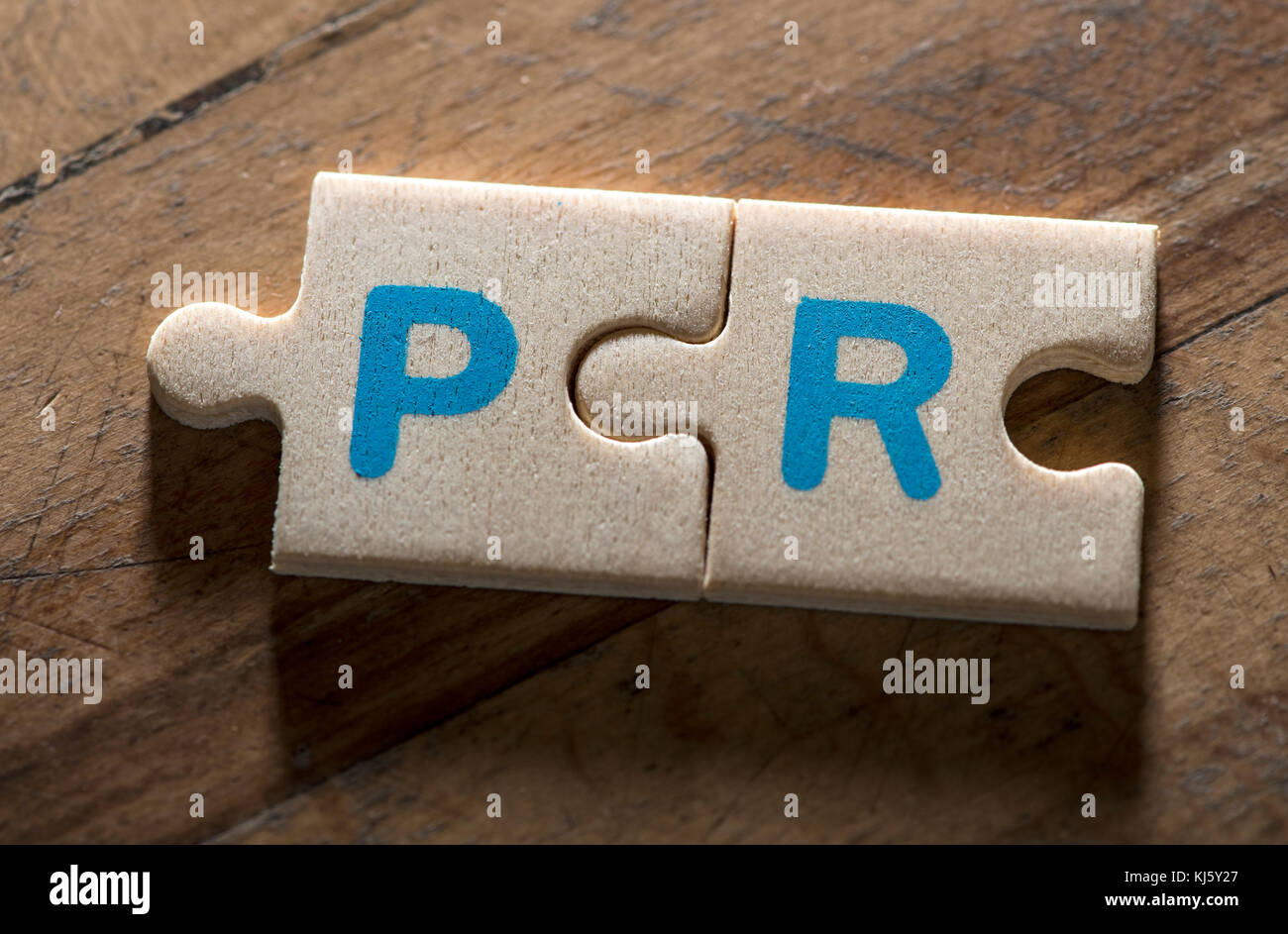 Word PR on wooden puzzle Stock Photo - Alamy