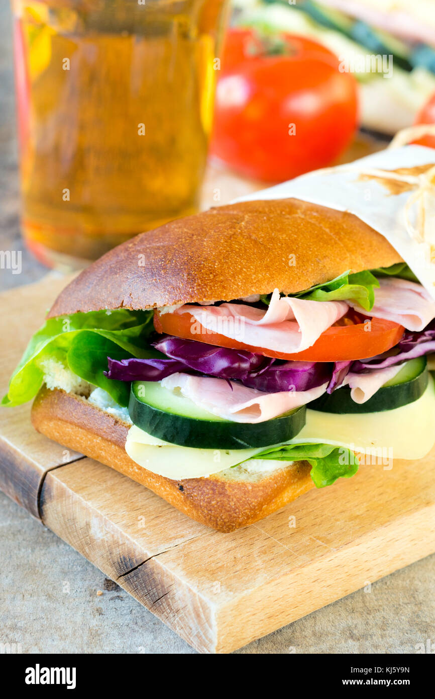 Fresh homemade sandwich stuffed with hamd and cheese.Selective focus on ...