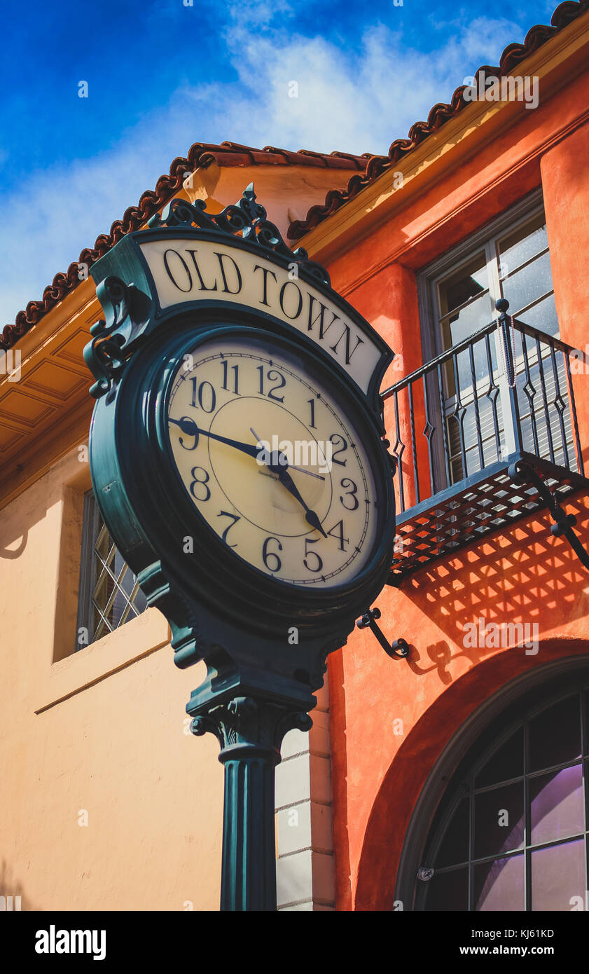 Vintage clock and vibrant buildings in the Old Town district of Santa ...