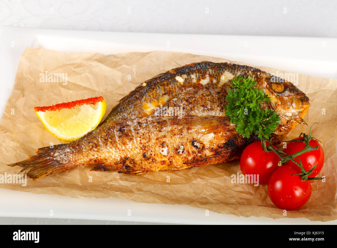 Roasted dorada fish Stock Photo - Alamy
