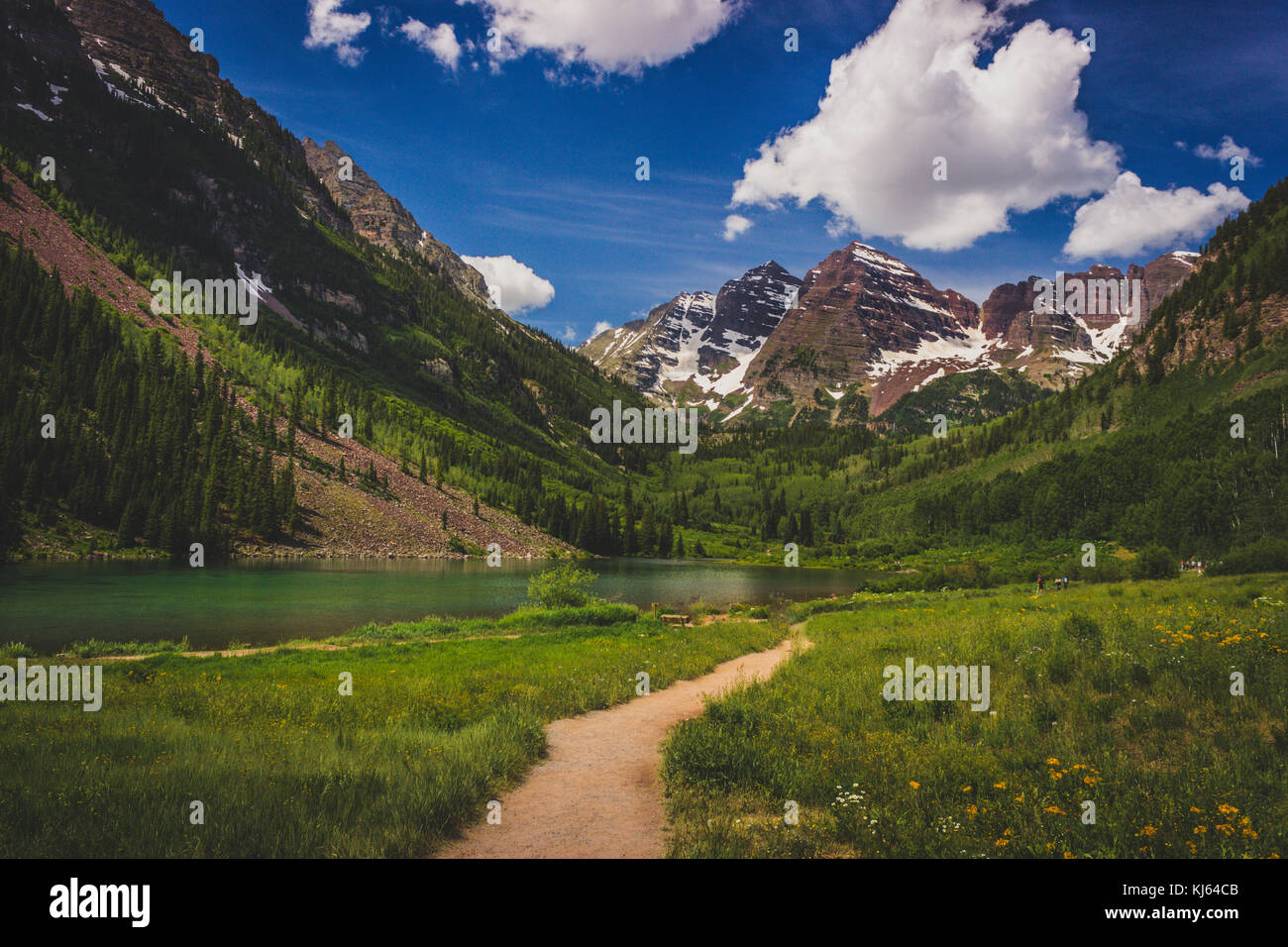 Stunning Maroon Bells peaks and trail leading to Maroon Lake in summer ...
