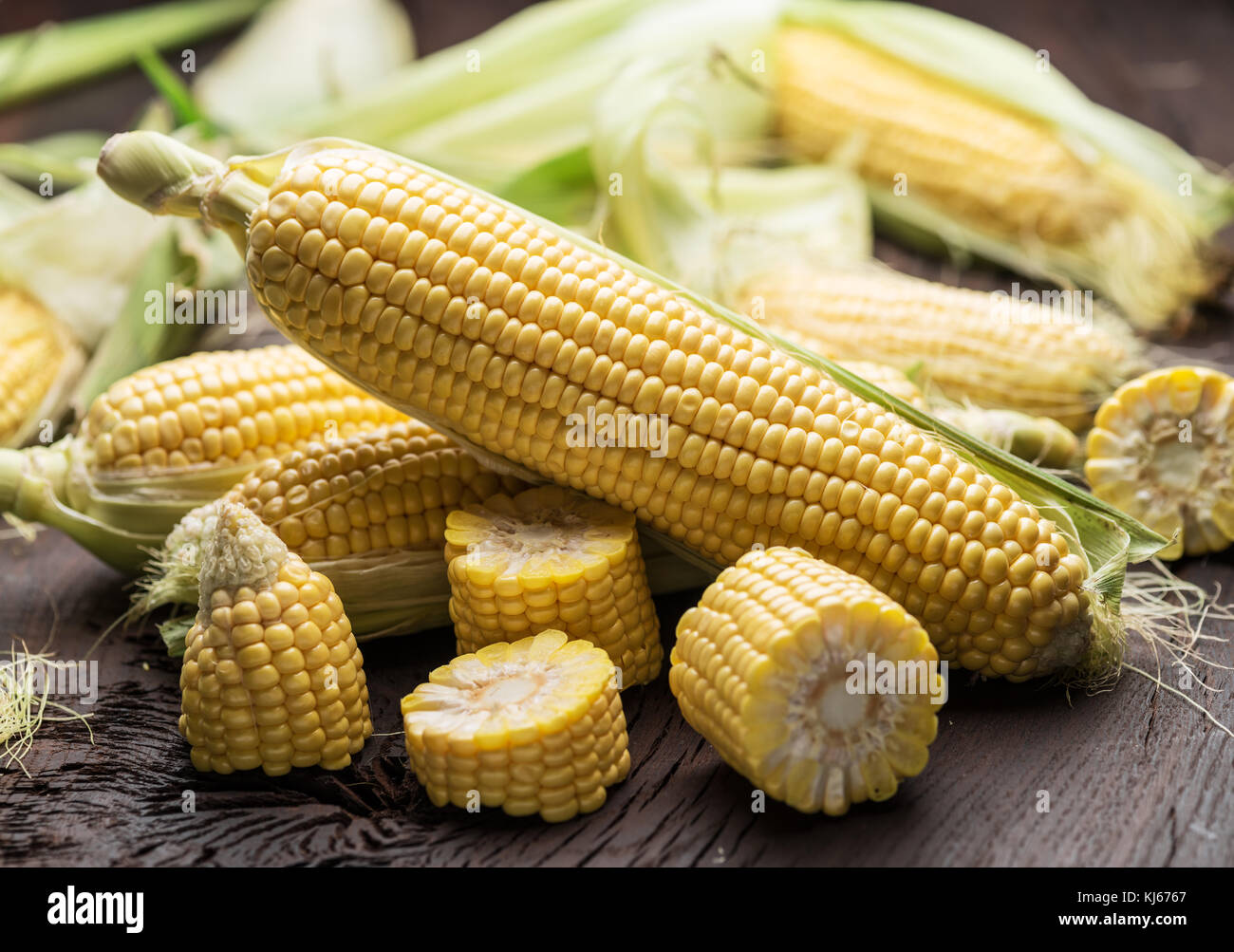 Ear of maize or corn on the dark wooden background Stock Photo - Alamy