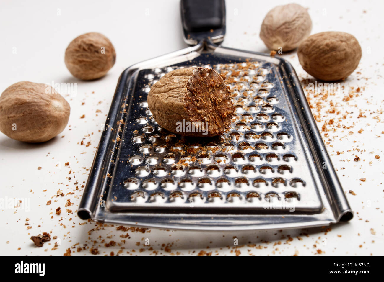 nutmeg and powder on a metal grater Stock Photo - Alamy