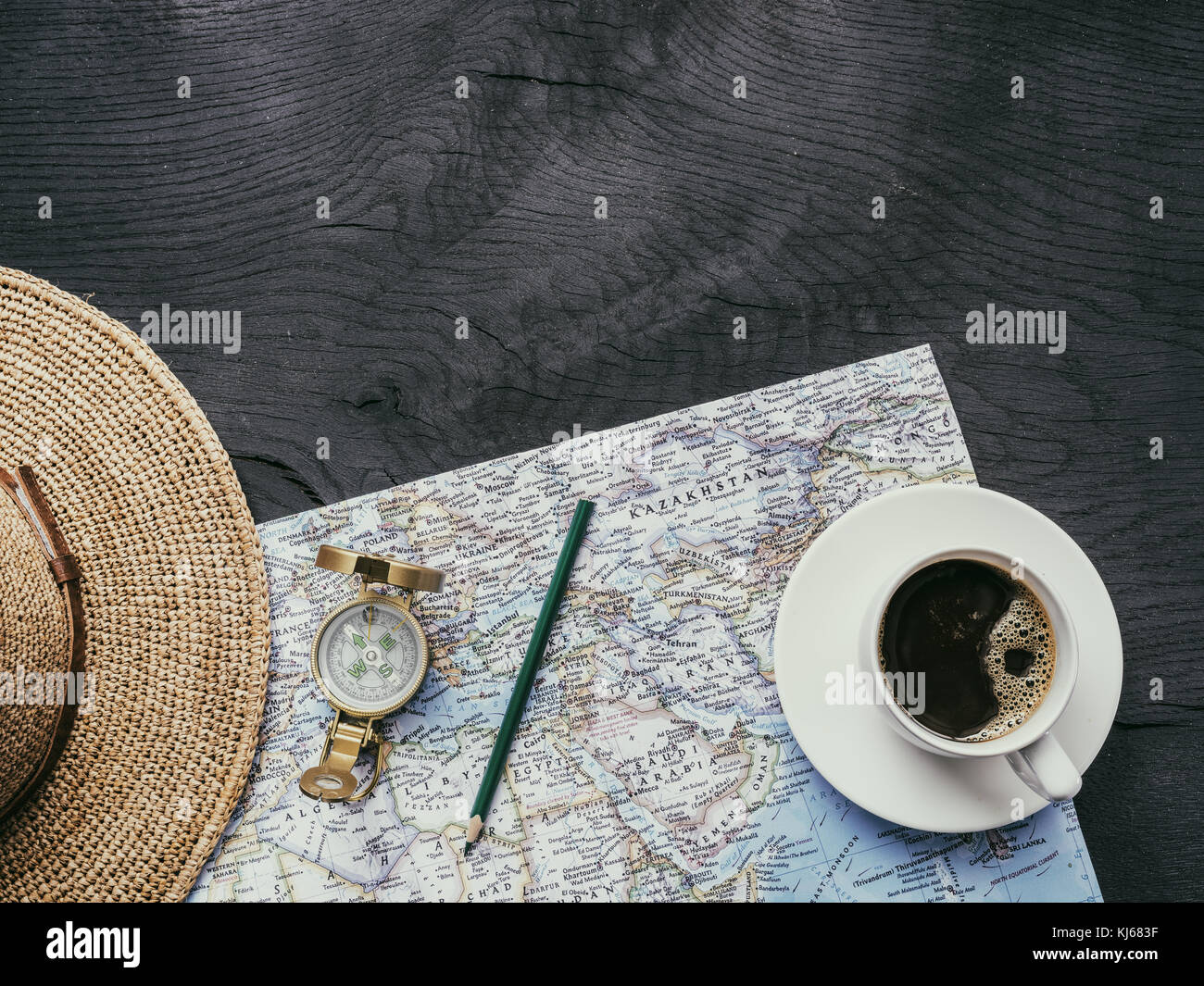 Planning new travel destinations on the world map. Top view Stock Photo ...