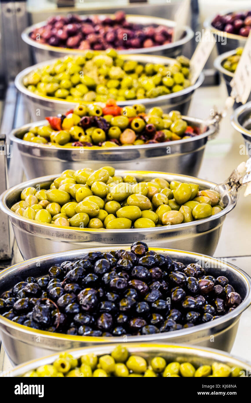 Different cured table olives in the bowls Stock Photo - Alamy
