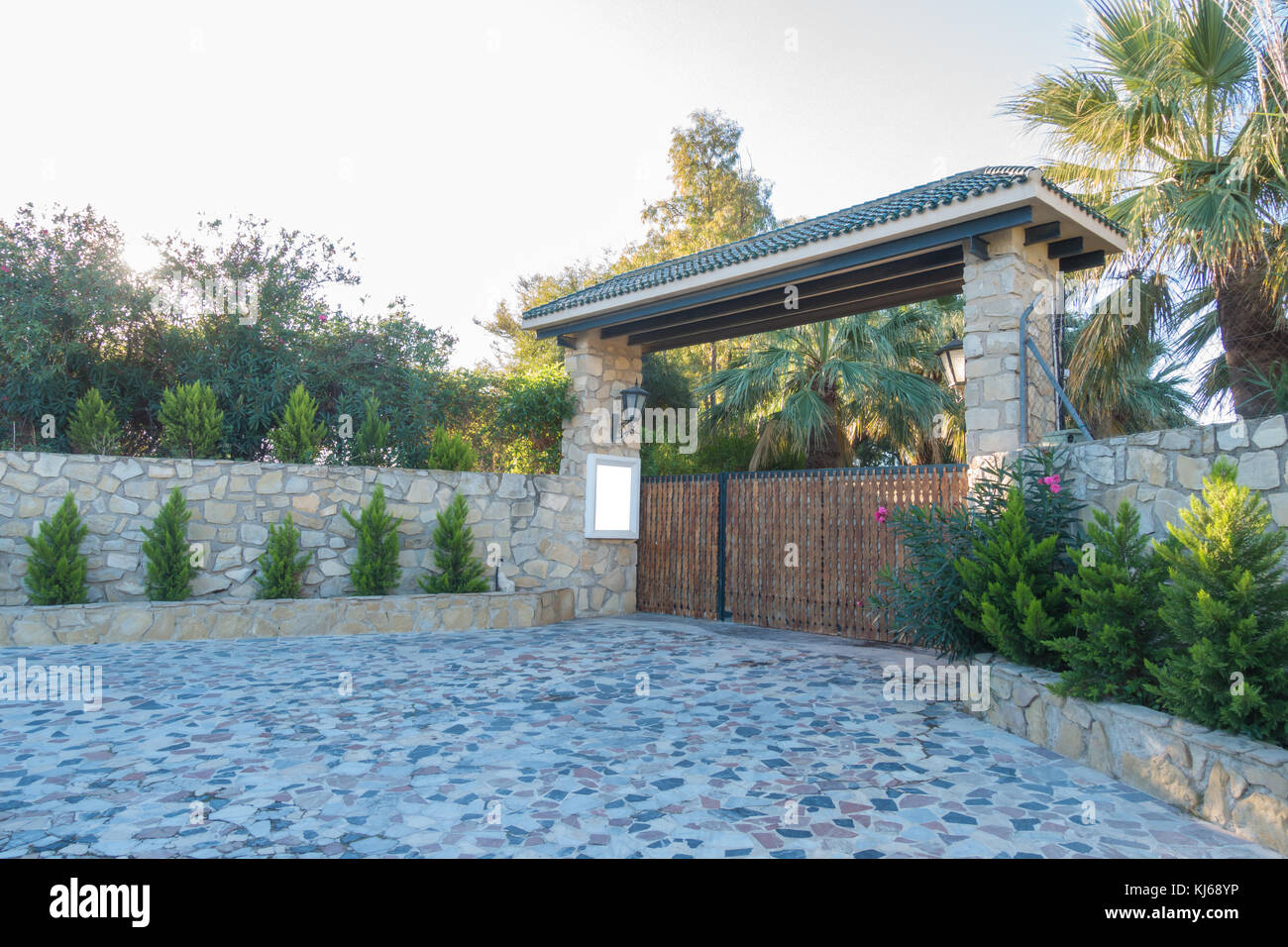 Mock up near the gate to the private house yard. Wooden gates and a ...