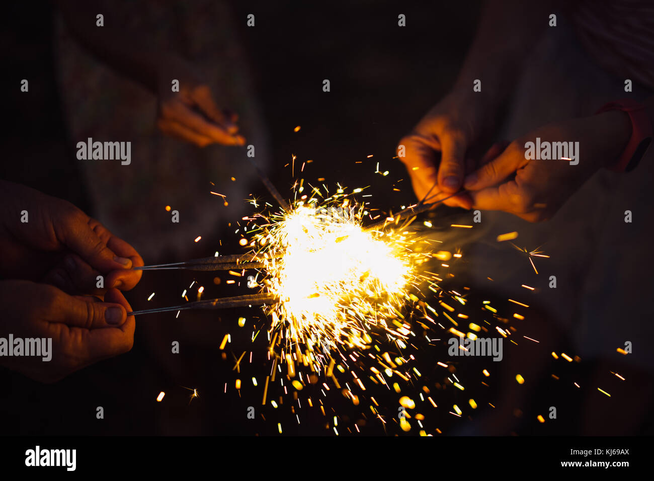 Anonymous person with burning firework Stock Photo - Alamy