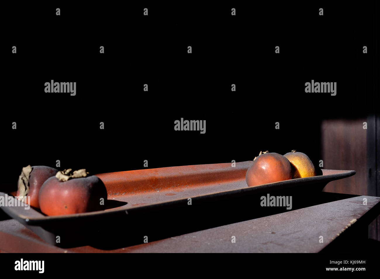 Burned persimmons hi-res stock photography and images - Alamy