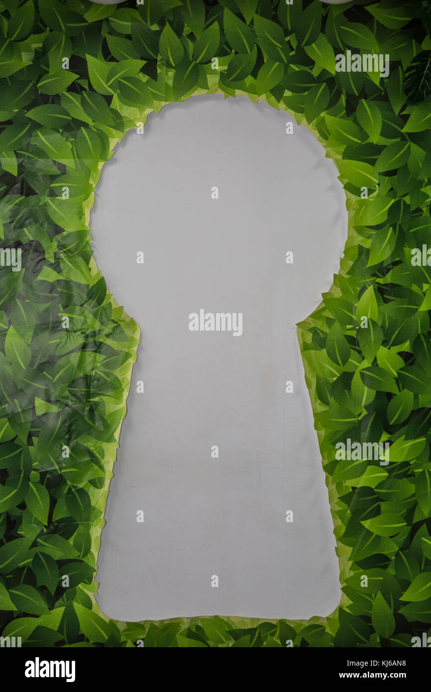 Green hedge with keyhole. ornamental keyhole in leaves Stock Photo - Alamy