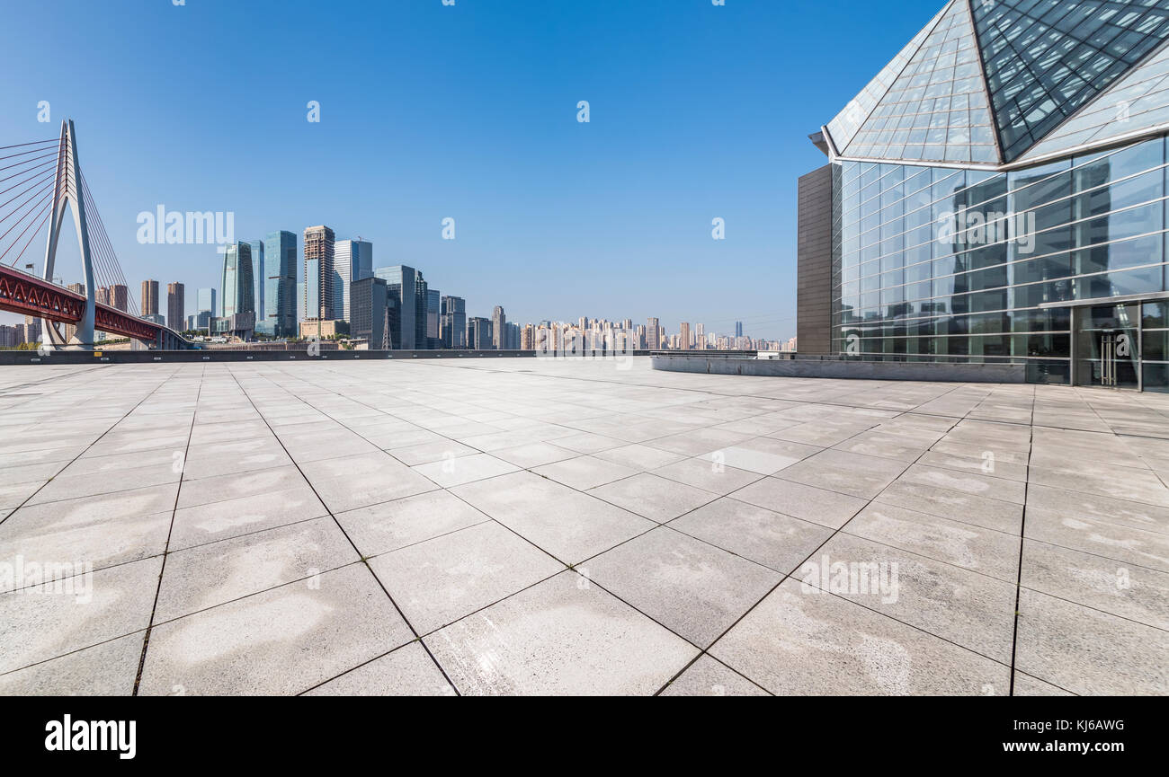 Panoramic skyline and buildings with empty concrete square floor ...