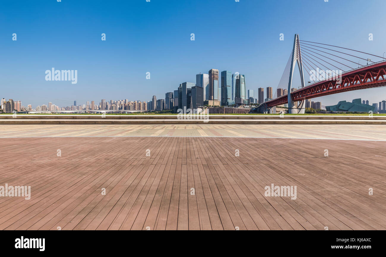 Panoramic skyline and buildings with empty concrete square floor ...