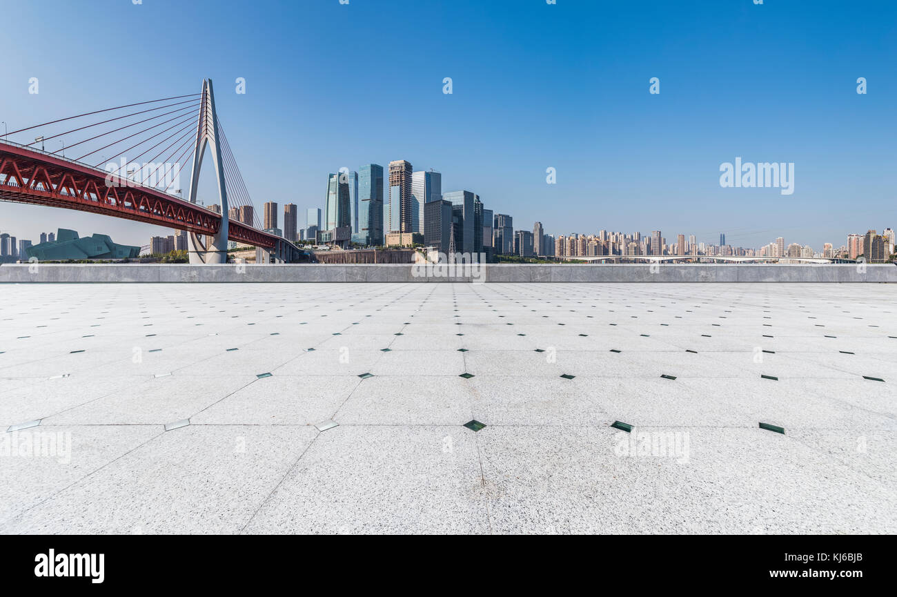 Panoramic skyline and buildings with empty concrete square floor ...