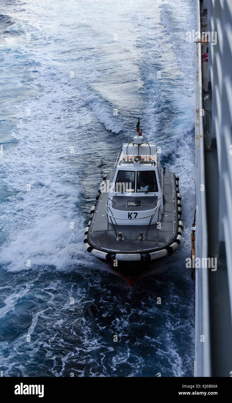 Italian Pilot Boat Alongside Moving Cruise Ship Stock Photo - Alamy