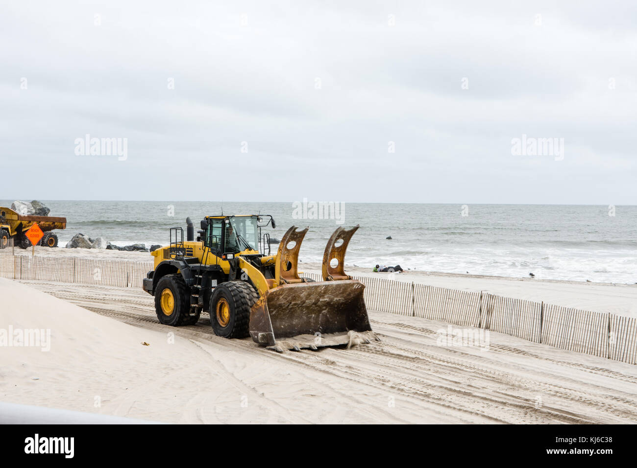 The bulldozer works on the seashore Stock Photo - Alamy