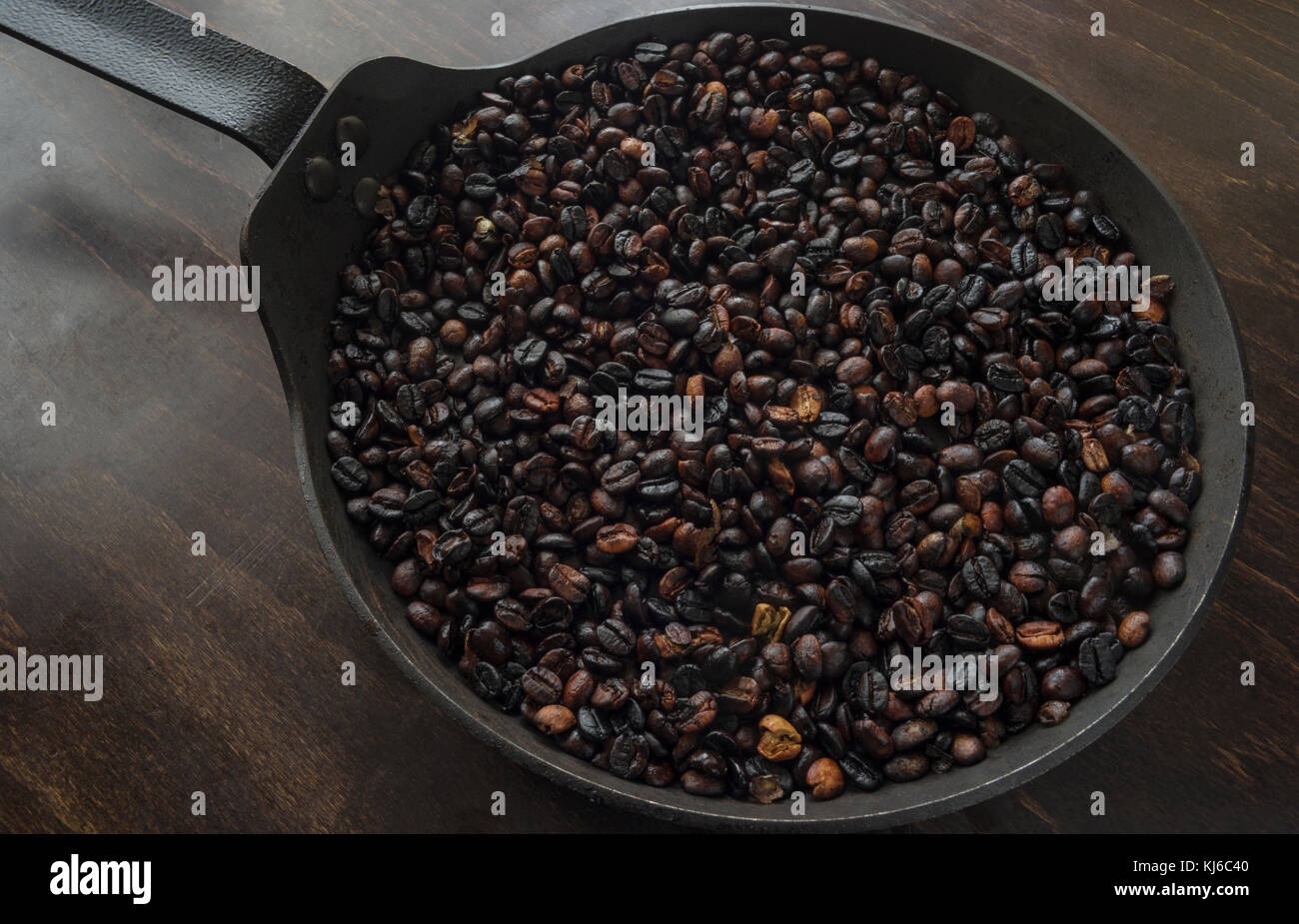 A pan with freshly brewed ground coffee beans Stock Photo - Alamy
