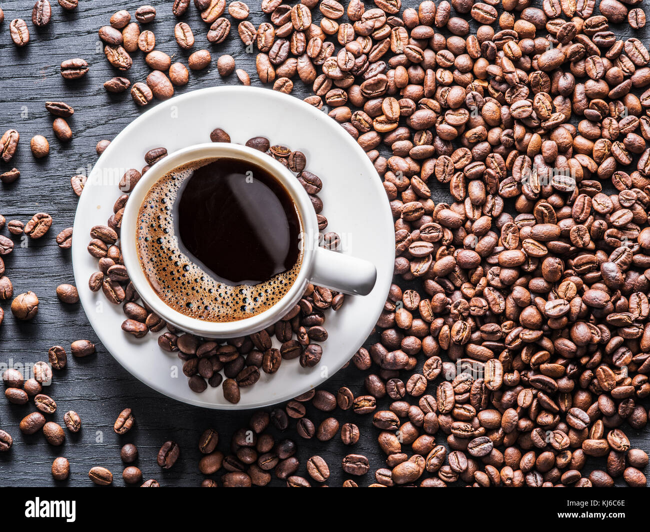 Cup of coffee surrounded by coffee beans hi-res stock photography and ...