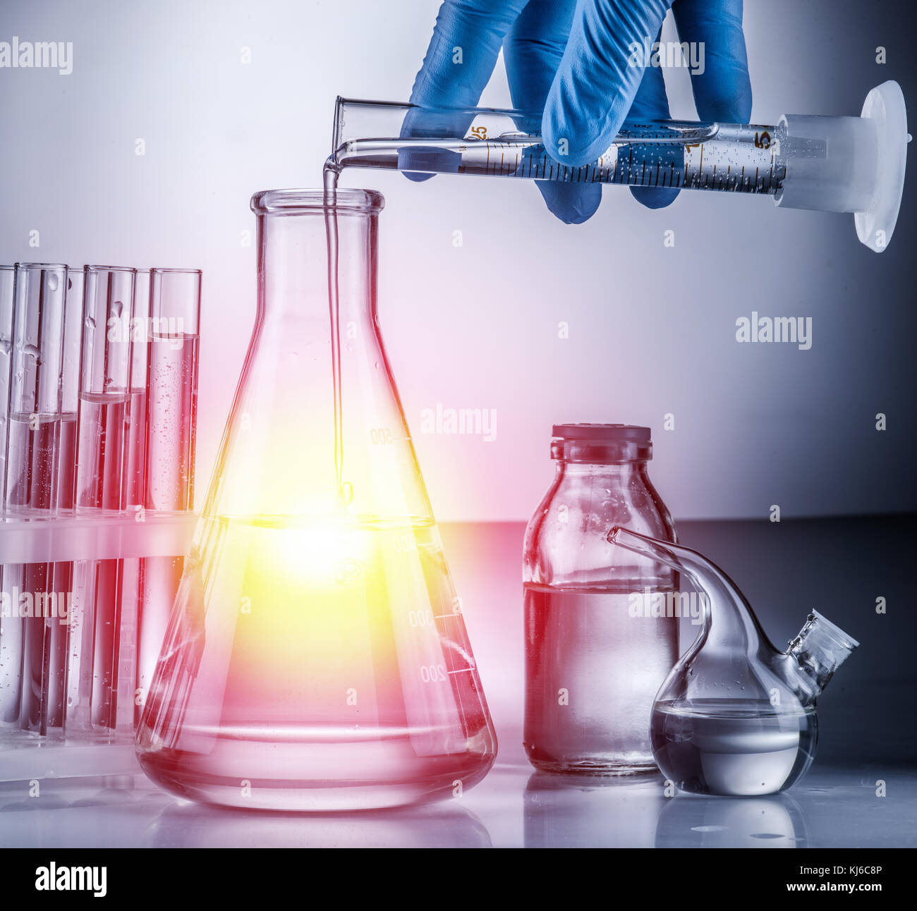 Different laboratory beakers and glassware. Chemical test in process ...