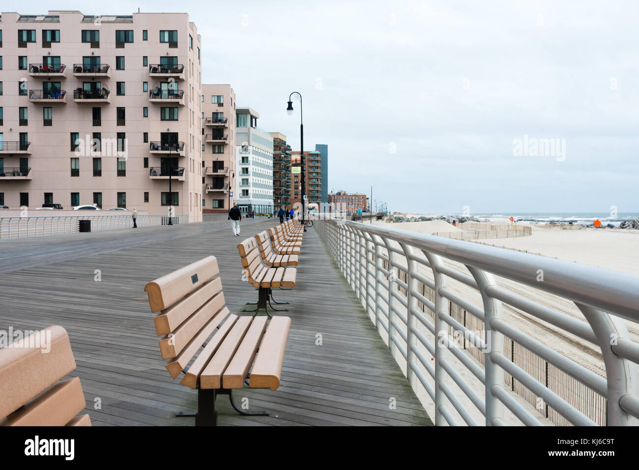 benches in a new area on the seaside promenade with wooden flooring ...
