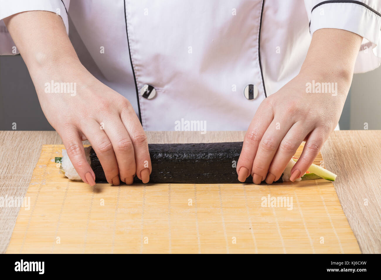 Japanese chef. Chef prepares rolls, hands closeup Stock Photo - Alamy