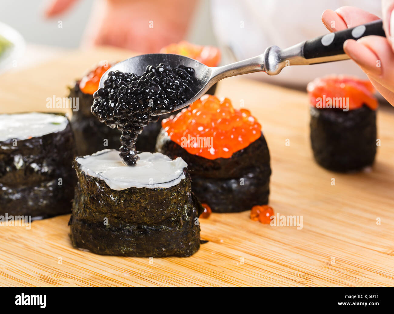 Japanese chef. Chef prepares rolls, hands closeup Stock Photo - Alamy