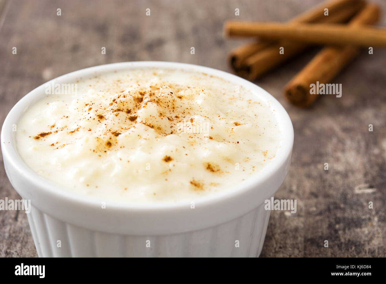 Arroz con leche. Rice pudding with cinnamon on wooden background Stock ...