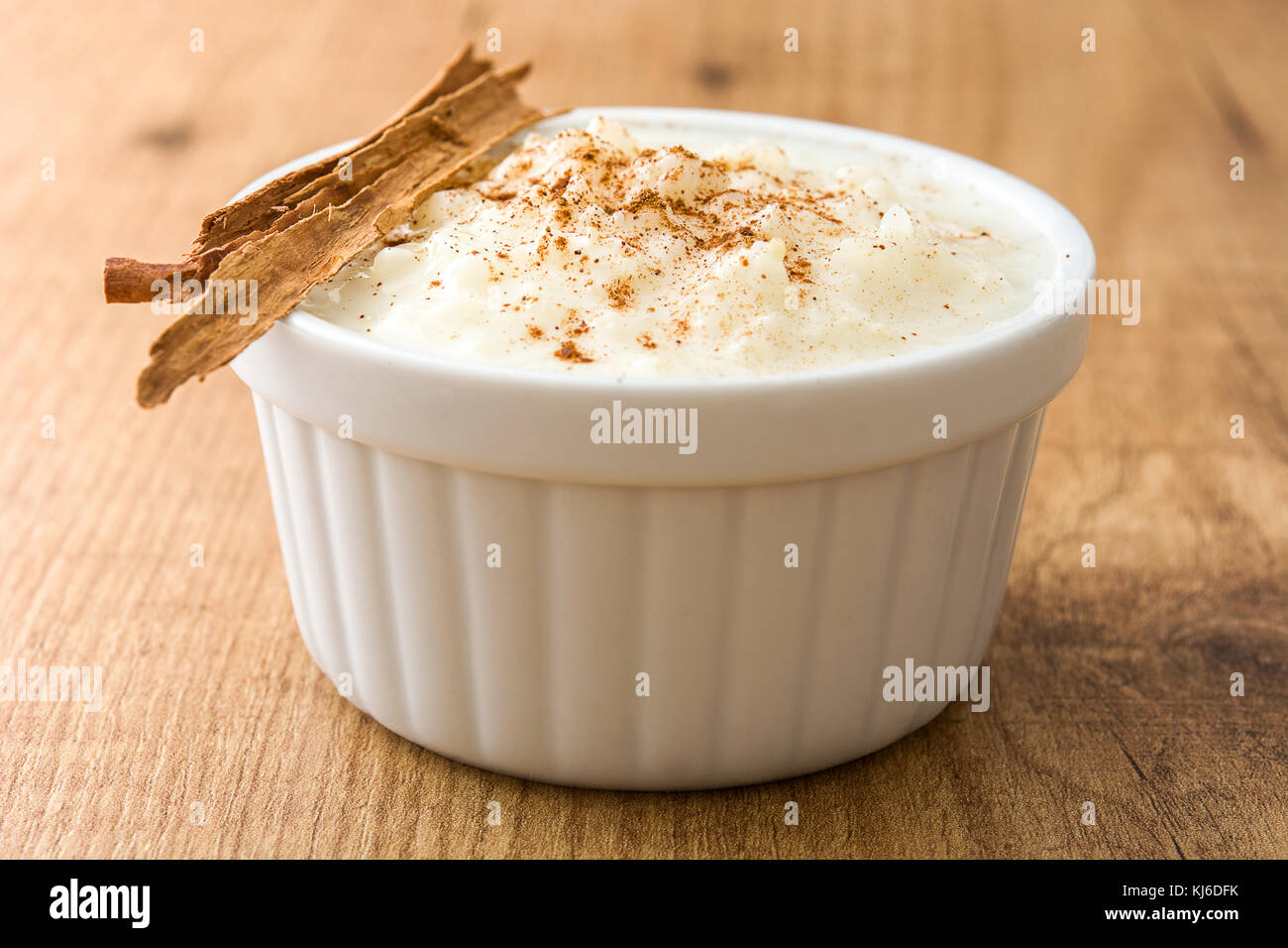 Arroz con leche. Rice pudding with cinnamon on wooden background Stock ...