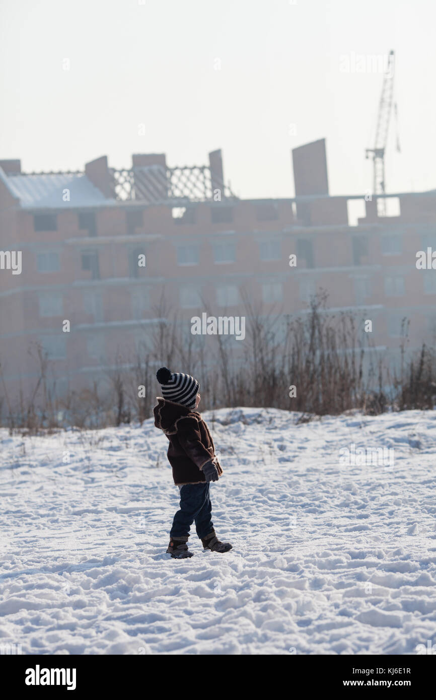 Boy dreams of becoming a builder Stock Photo - Alamy