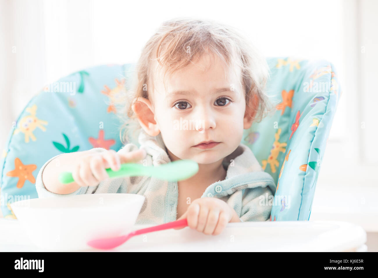The girl is eating very fast Stock Photo - Alamy